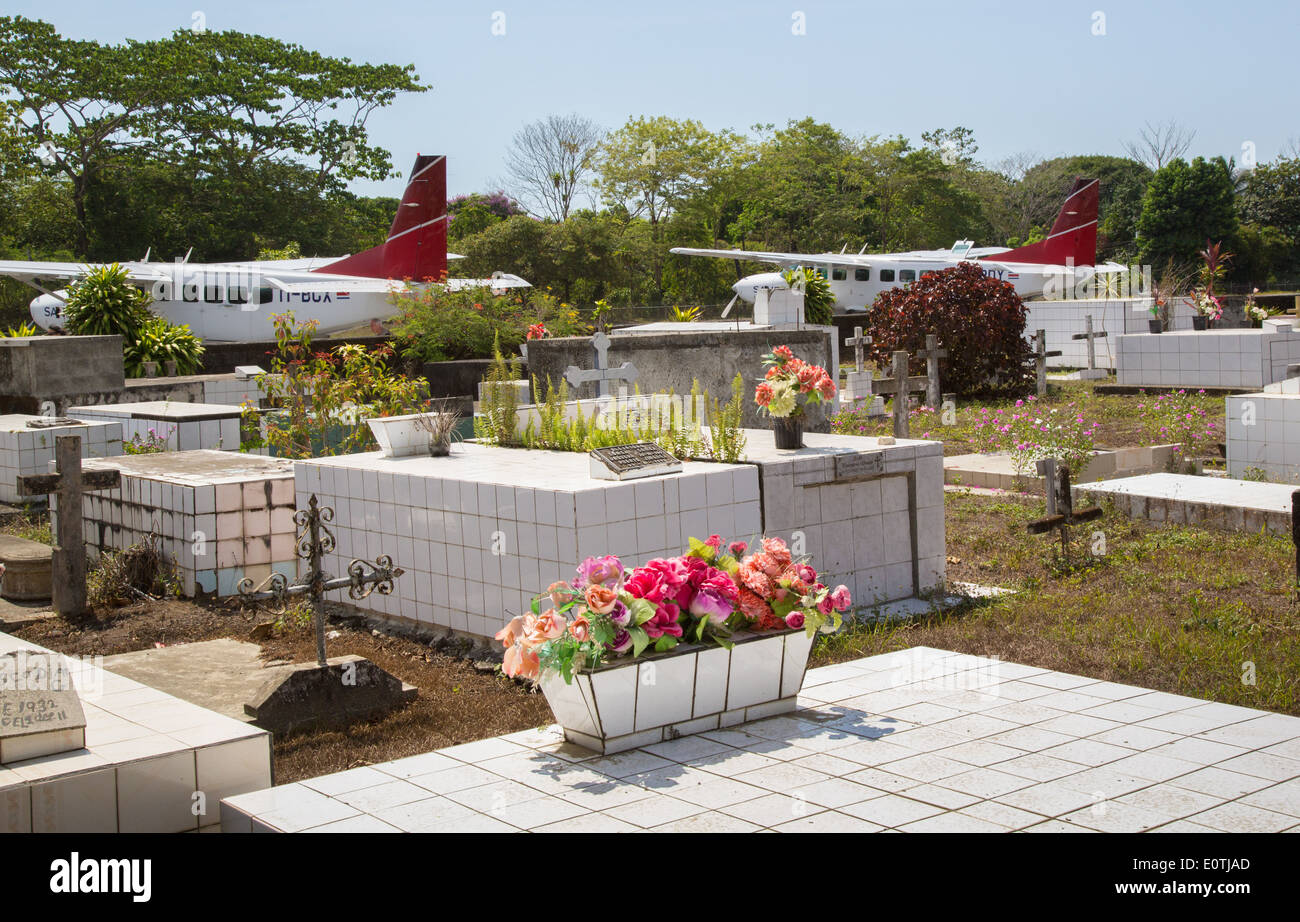 Graves and planes - cemetery beside the runway of Puerto Jimenez ...