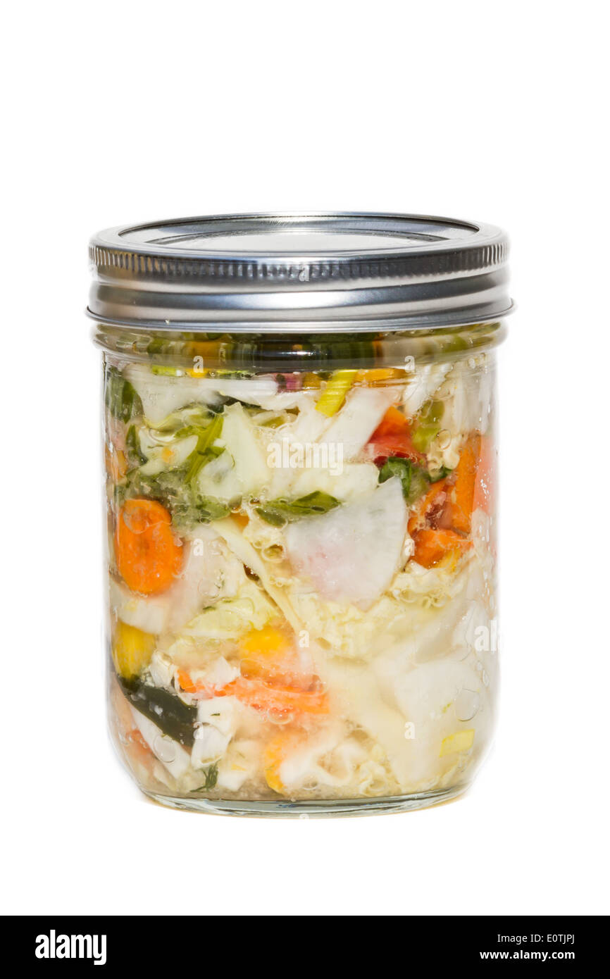 jar of cultured or fermented vegetables isolated on a white background ...
