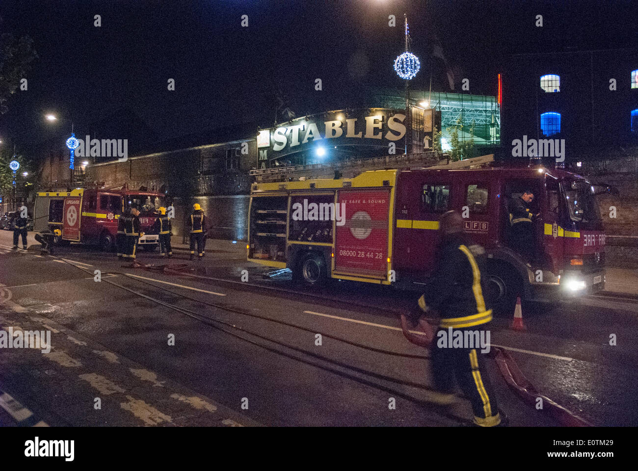 London, UK. 20th May 2014. Firemen work around a Fire Engine at the ...