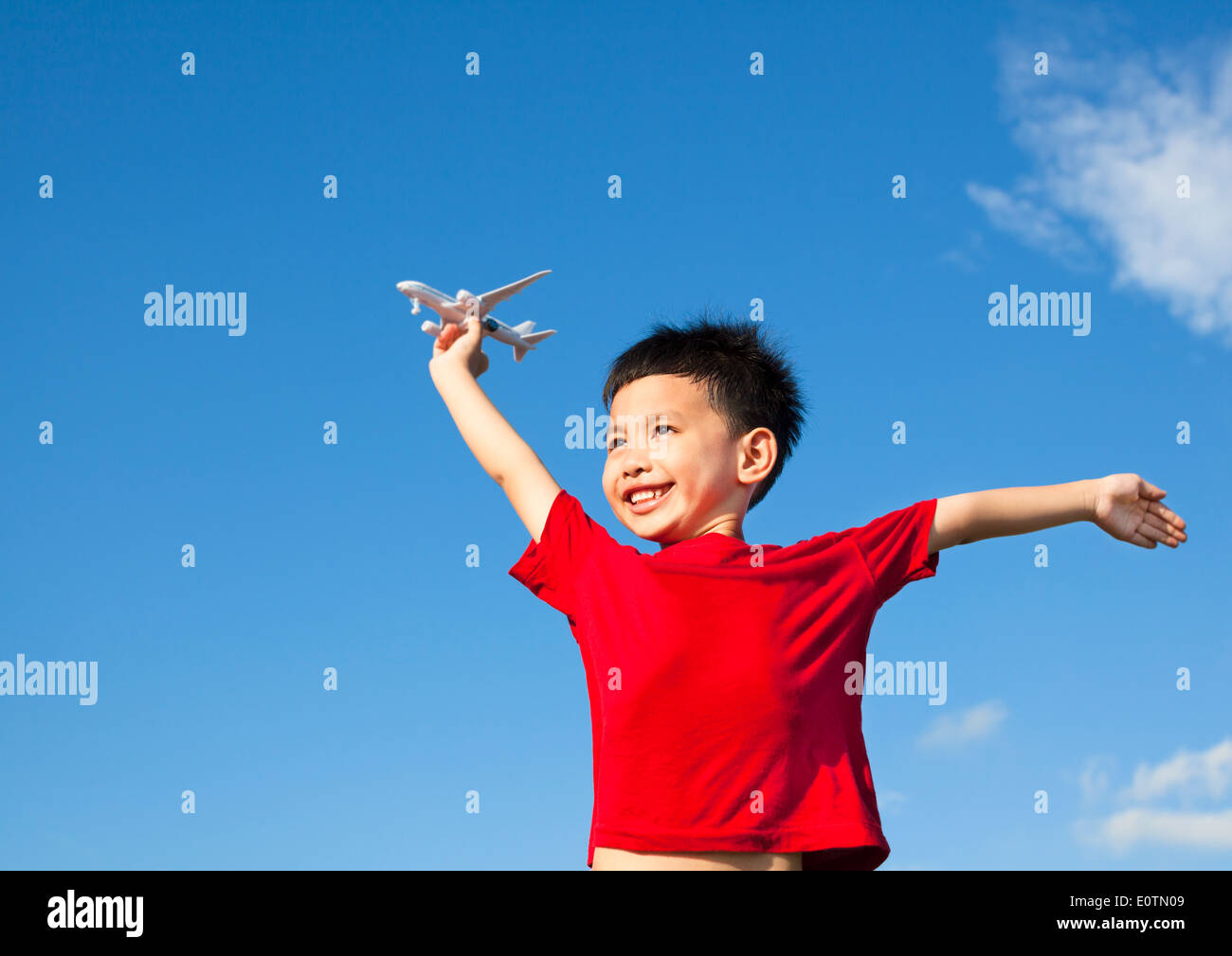 happy boy holding a airplane toy and open arms Stock Photo - Alamy