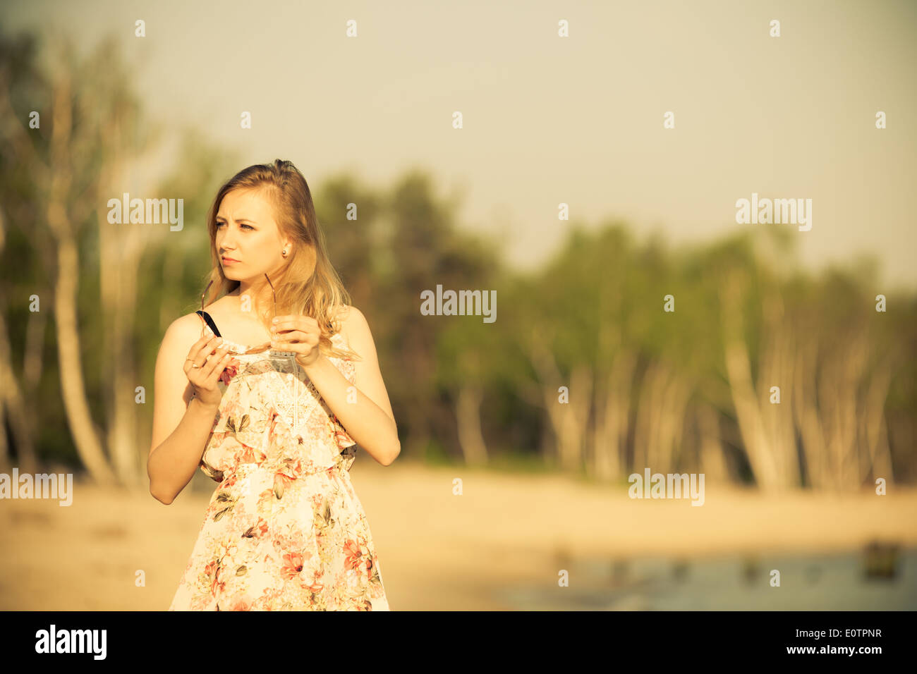 Summer vacation. Girl walking alone on the beach Stock Photo - Alamy