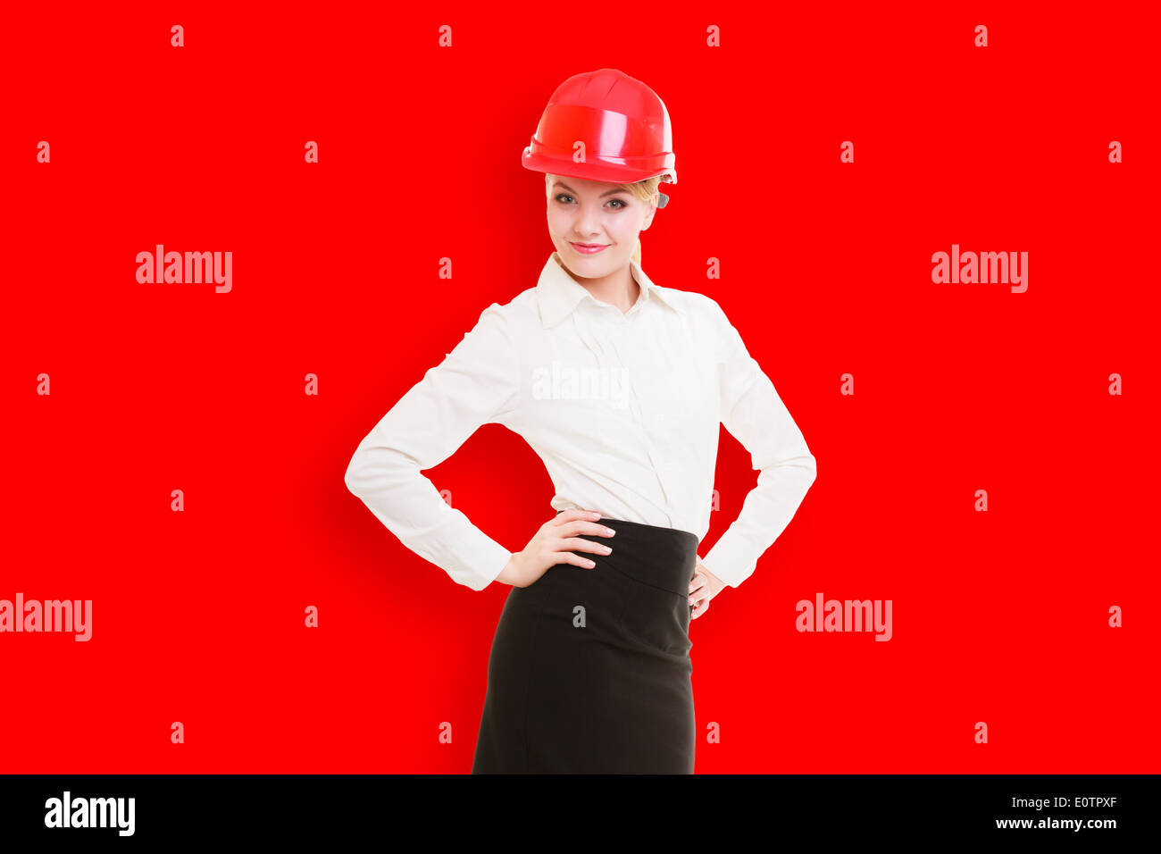 Female engineer woman architect in red safety helmet Stock Photo - Alamy