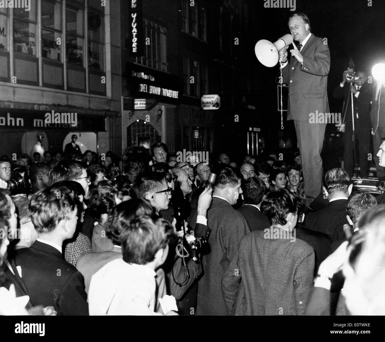 Reverend Billy Graham speaks from on top of car Stock Photo - Alamy