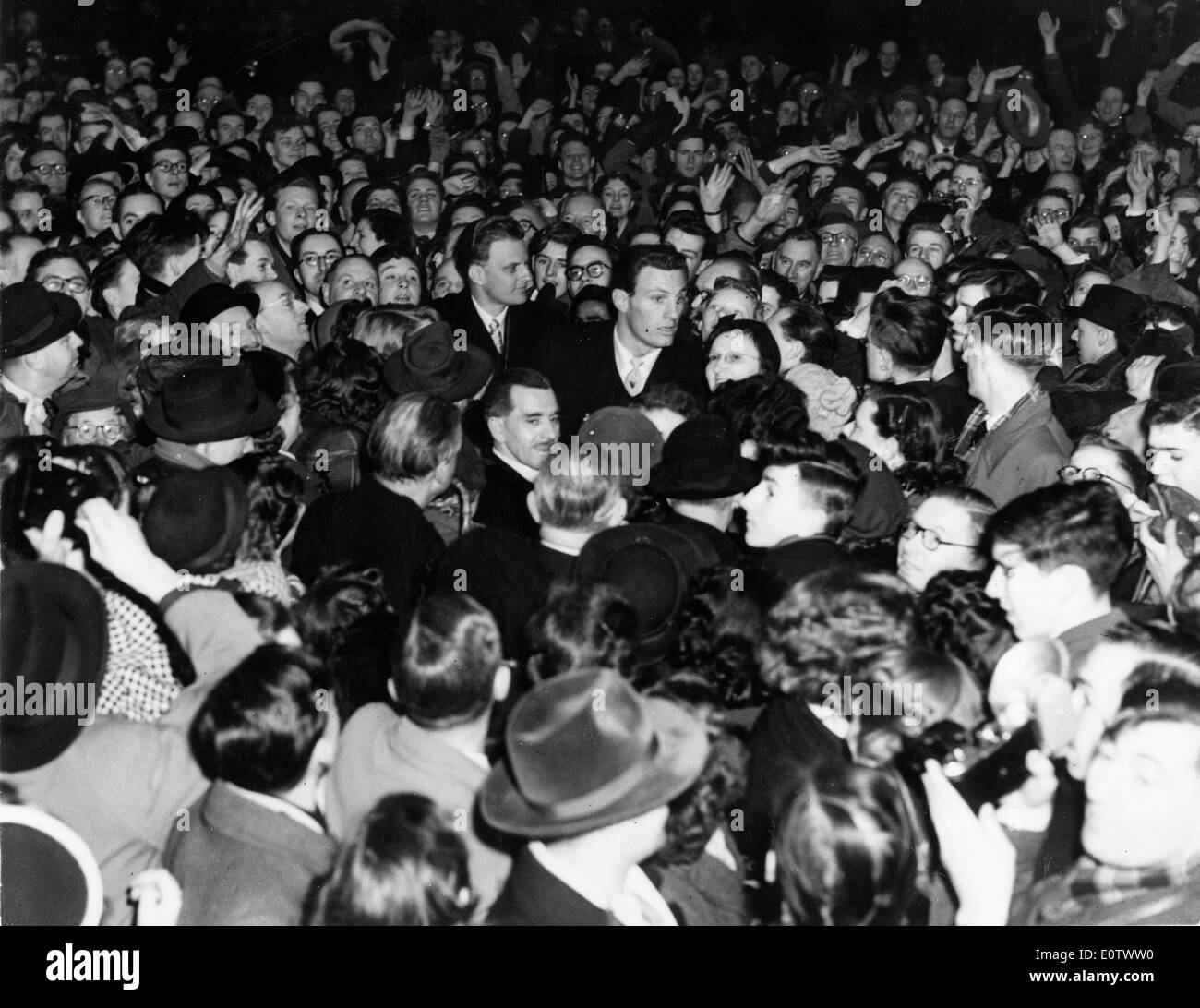 Pushing through crowd Black and White Stock Photos & Images - Alamy