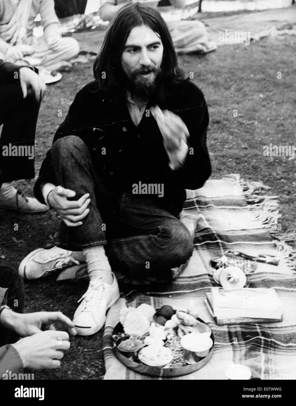 Beatle George Harrison eating at a picnic Stock Photo - Alamy