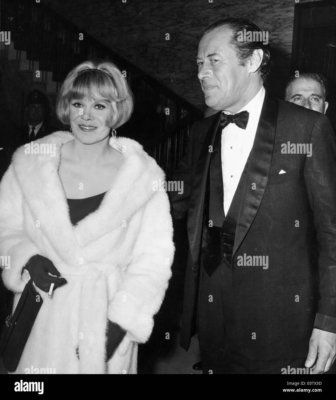 Actors Rex Harrison and Rachel Roberts arrive at event Stock Photo - Alamy