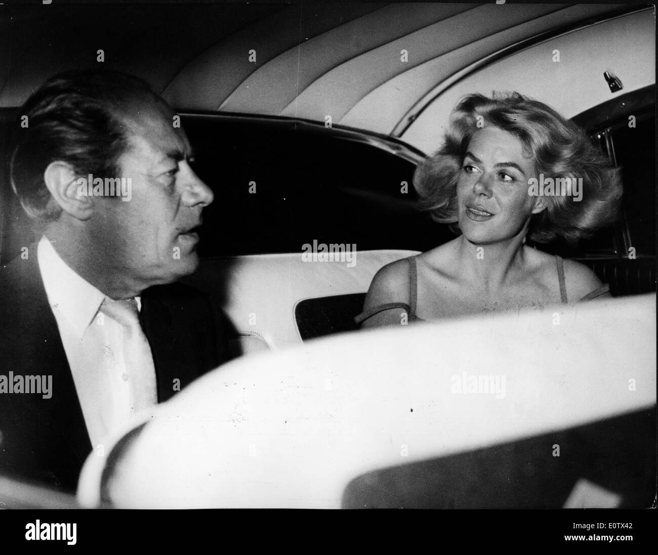 Actor Rex Harrison in the car with wife Rachel Roberts Stock Photo - Alamy