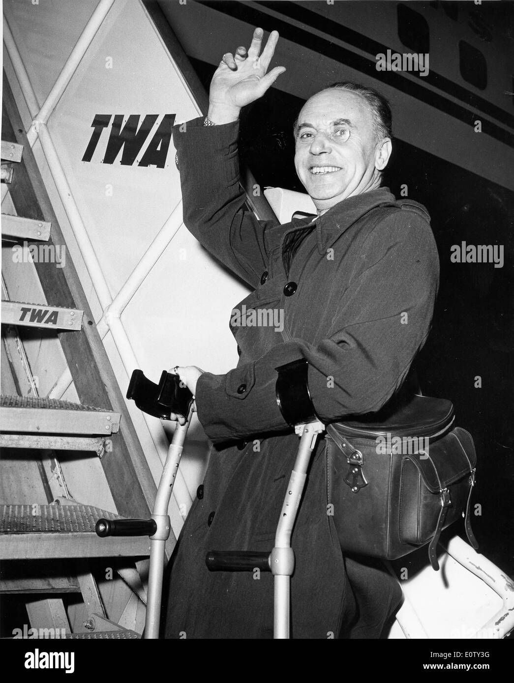 Actor Martyn Green boarding an airplane Stock Photo - Alamy