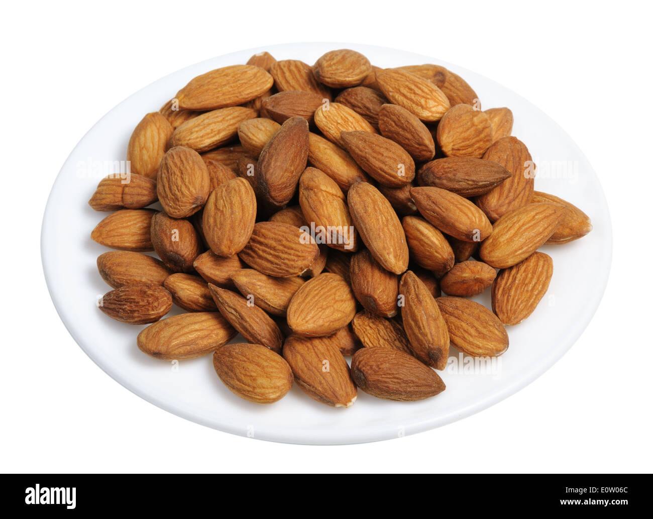 Almonds in a plate on white background, isolated Stock Photo - Alamy