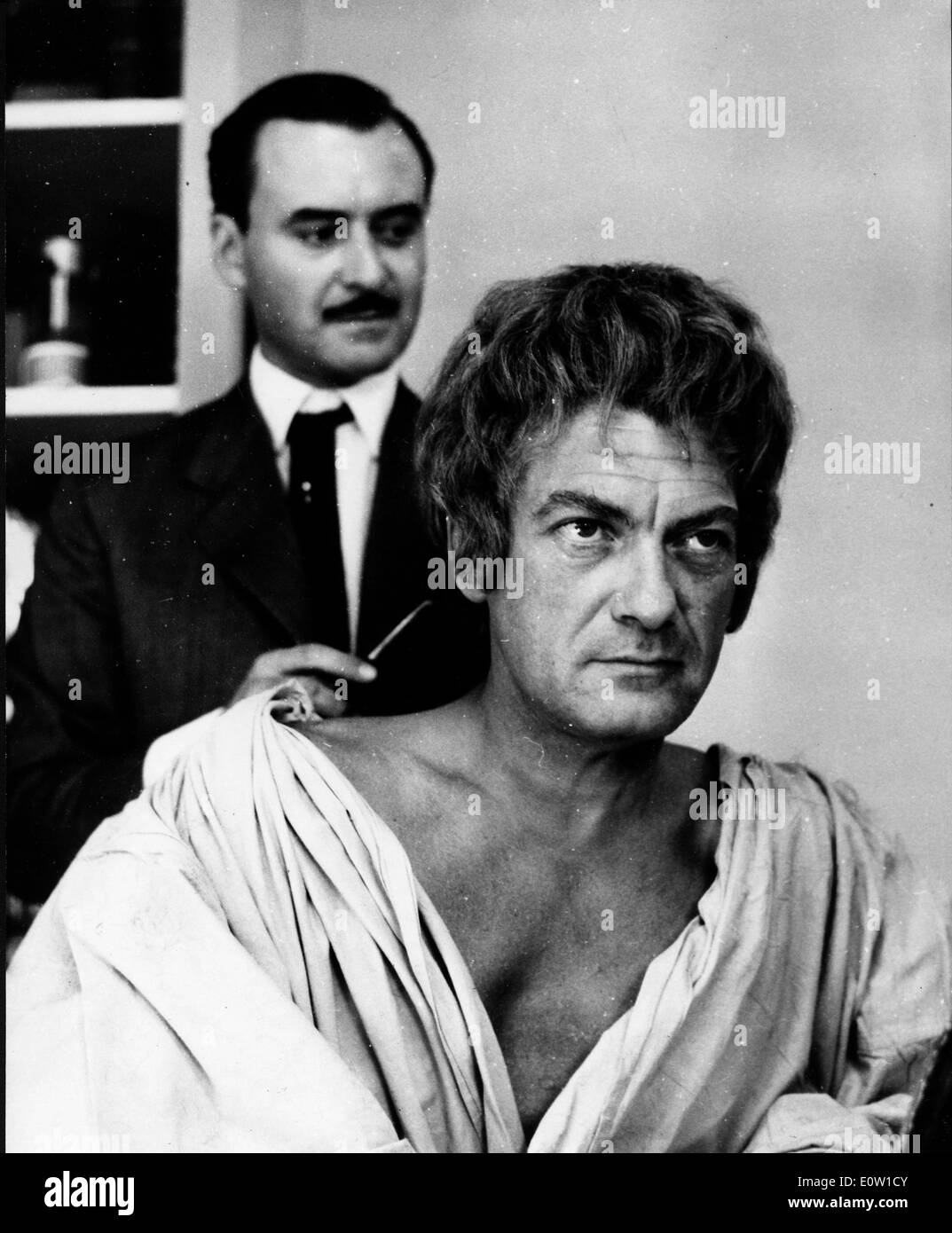 Actor Jean Marais getting into costume Stock Photo - Alamy