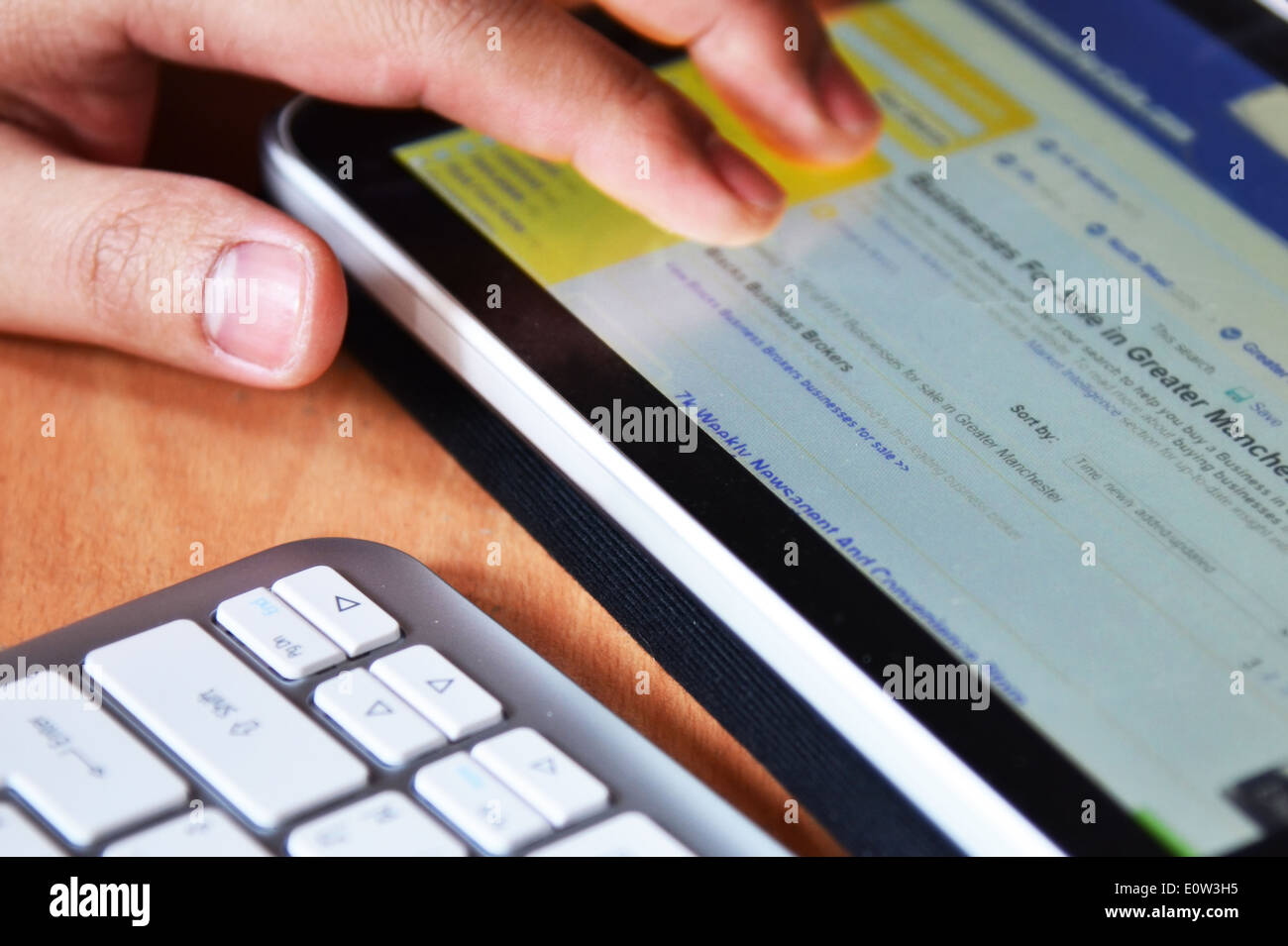 Touching ipad hi-res stock photography and images - Alamy