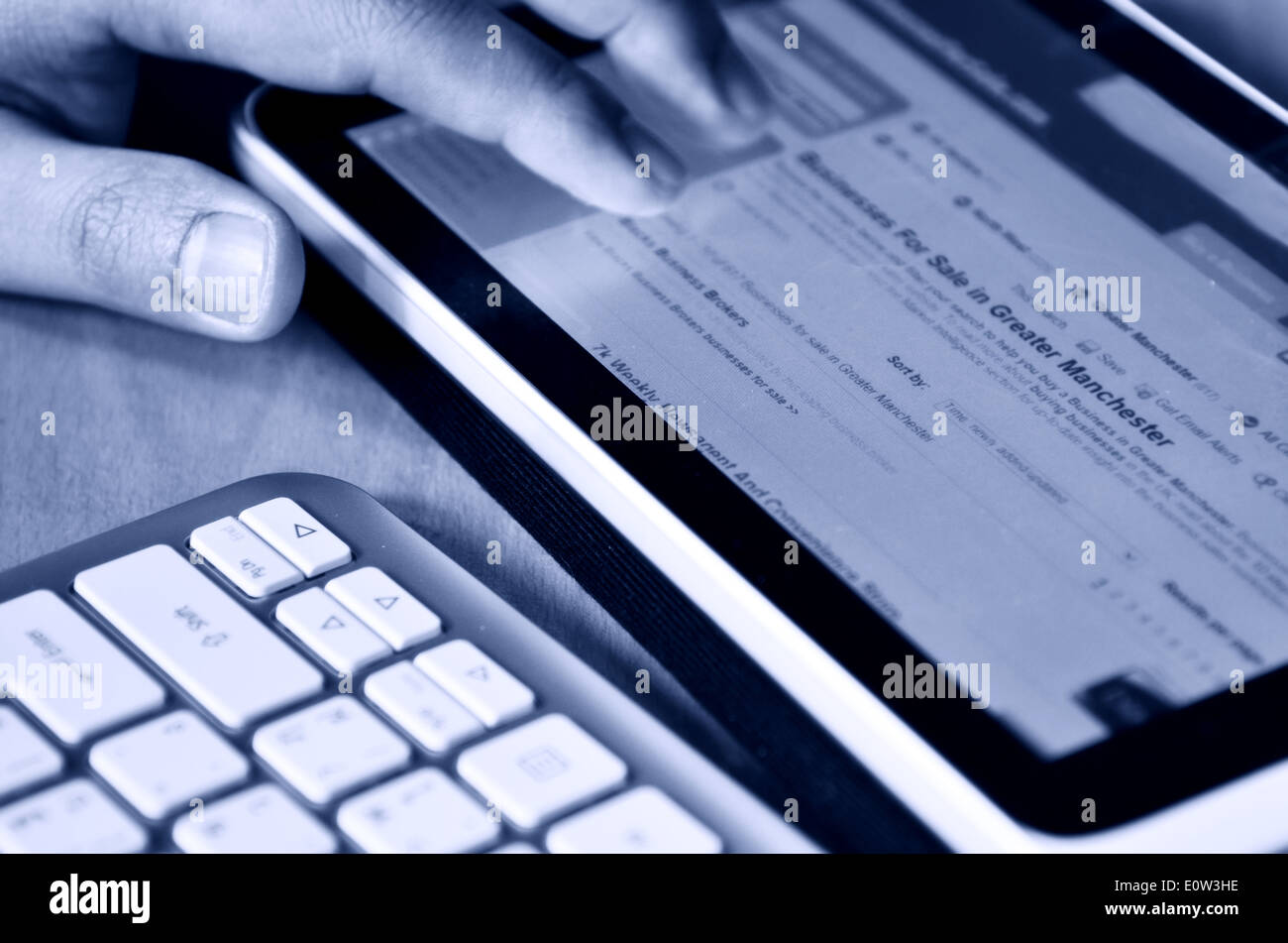 Touching ipad screen hi-res stock photography and images - Alamy