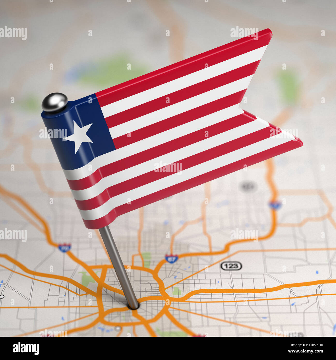 Small Flag Republic of Liberia on a Map Background with Selective Focus ...