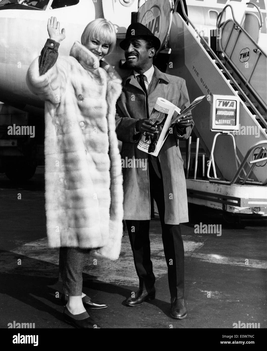 Sammy Davis Jr. boarding a plane to Los Angeles with wife May Britt ...