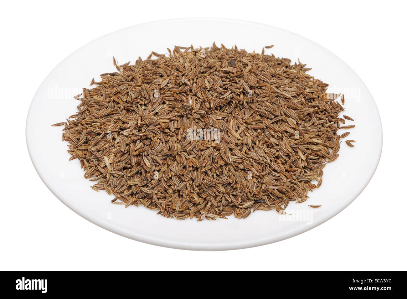 Cumin seeds on a white background, isolated Stock Photo - Alamy