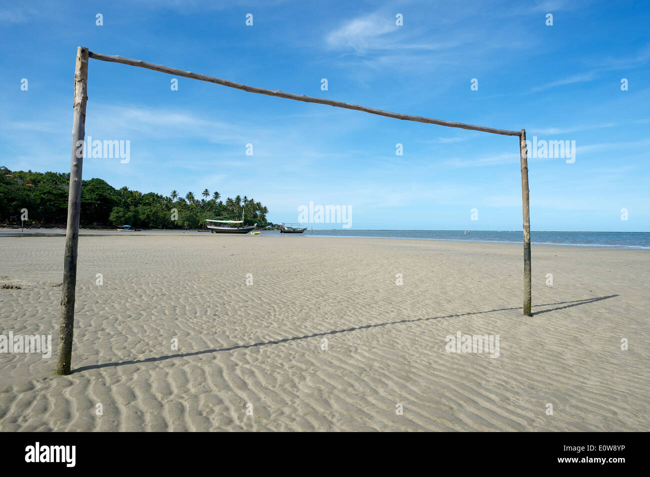 Simple empty Brazilian beach football pitch with rustic goal posts ...