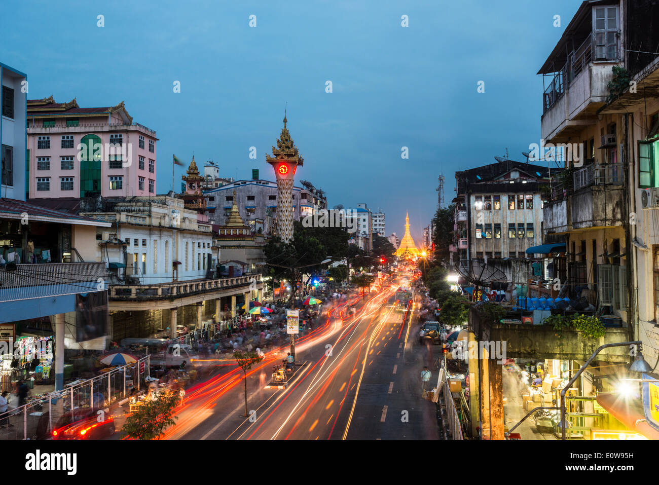 Clock tower, Sule Pagoda at the back, at dusk, blue hour, road traffic ...