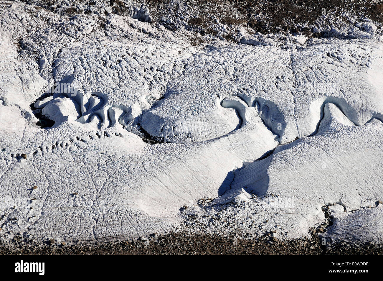 Meandering meltwater stream in glacial ice, Gornergrat Ridge, Zermatt ...
