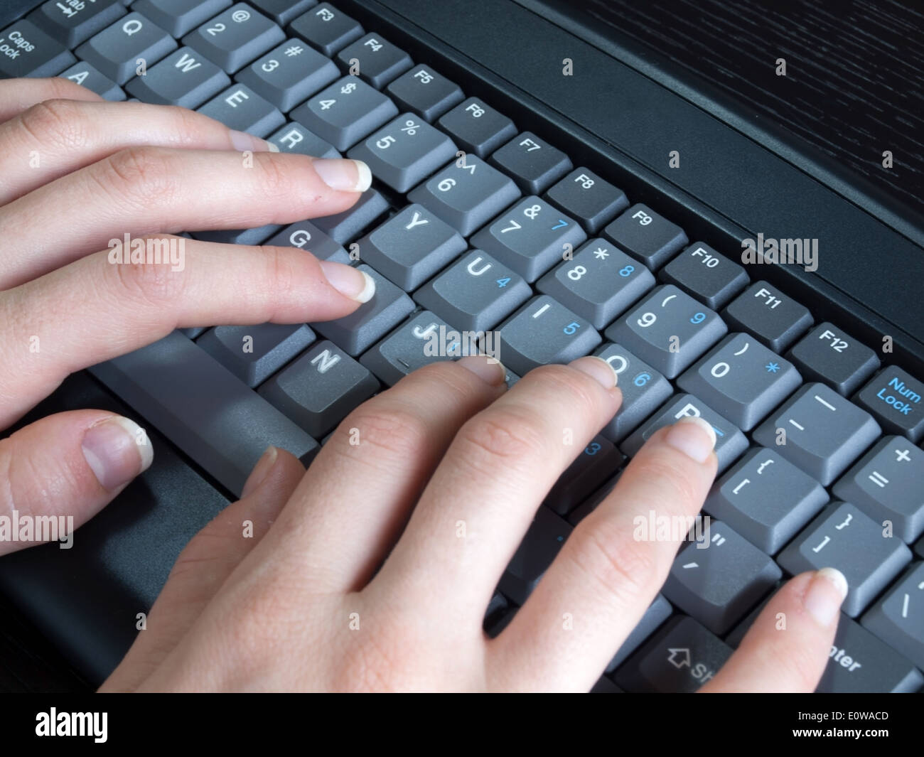 Black woman typing at computer hi-res stock photography and images - Alamy