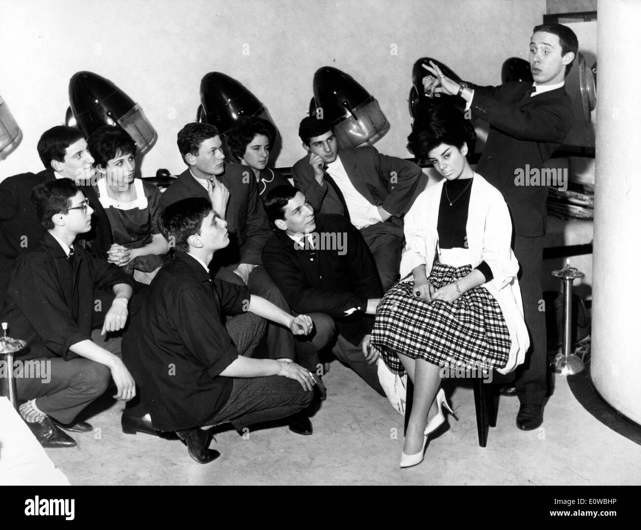 Woman surrounded by men Black and White Stock Photos & Images - Alamy
