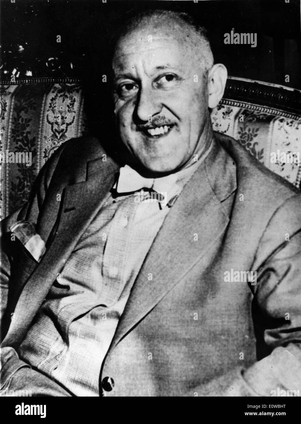 Seated man smiling Black and White Stock Photos & Images - Alamy