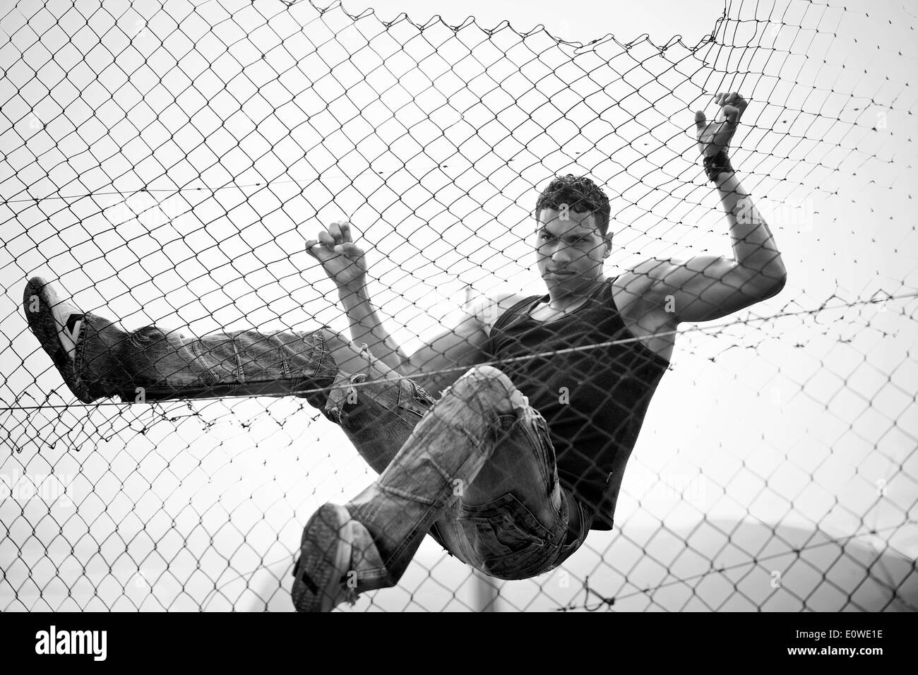 Climbing a fence hi-res stock photography and images - Alamy