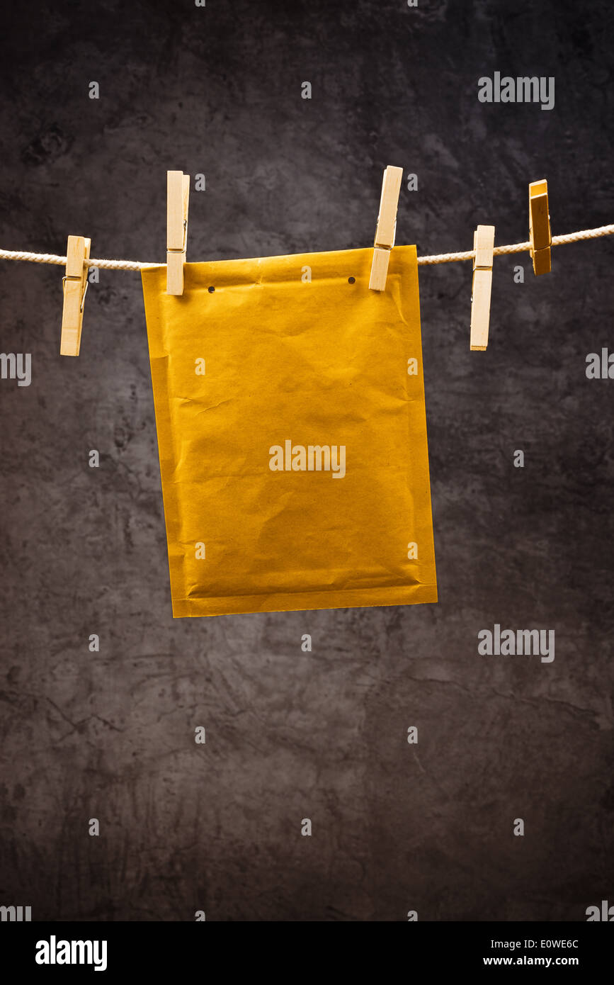 Postal mail Envelope hanging on rope attached with clothes pins ...