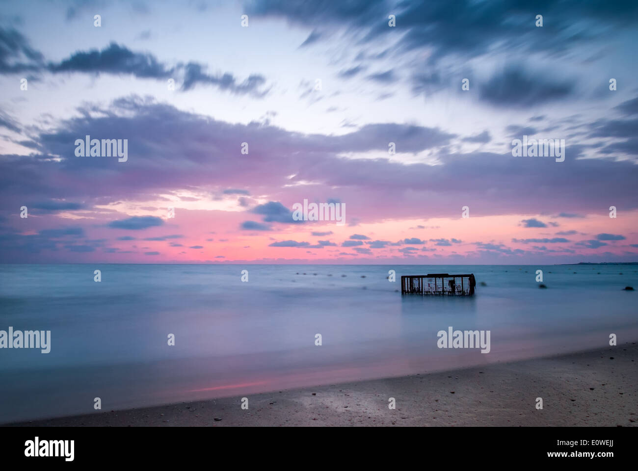 Tropical Beach with Empty Cage in the Sea at Colorful Sunset Stock ...