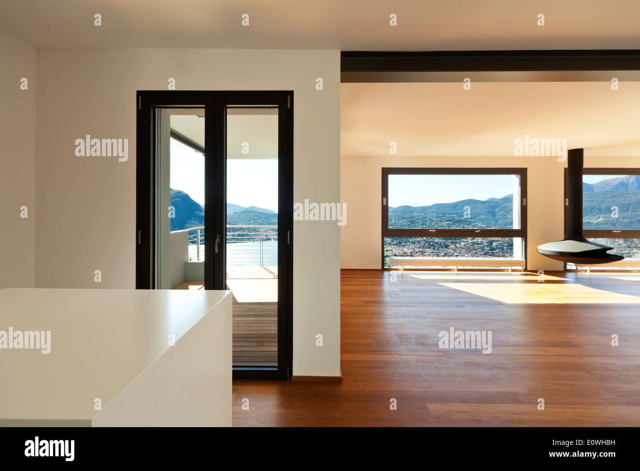 Modern apartment, large room with windows Stock Photo - Alamy