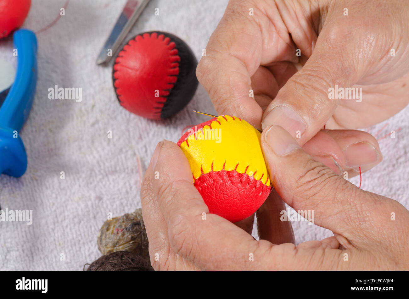 Expert hands crafting traditional sport balls Stock Photo - Alamy