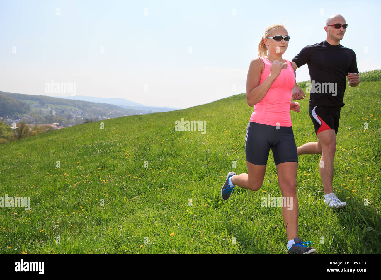Woman running through field hi-res stock photography and images - Alamy
