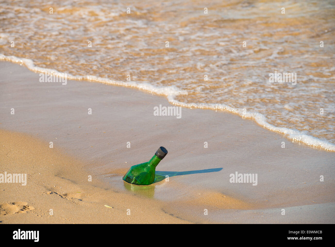Green glass bottle washed ashore, will it contain a message Stock Photo ...