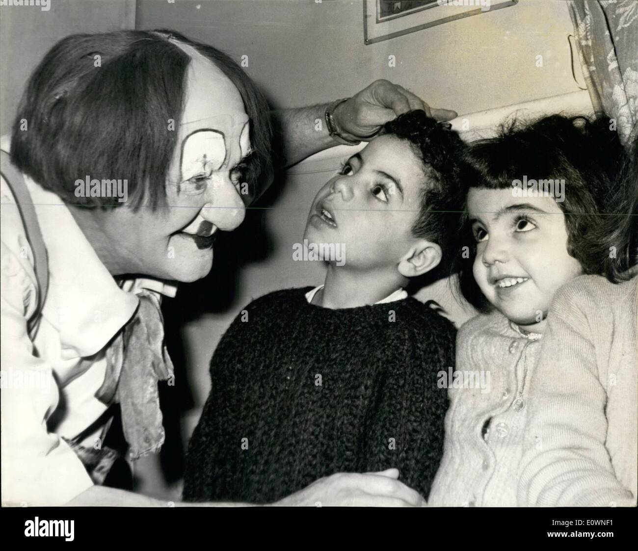 Dec. 12, 1963 - Refugees meet ''Coco'' their first clown. the two ...