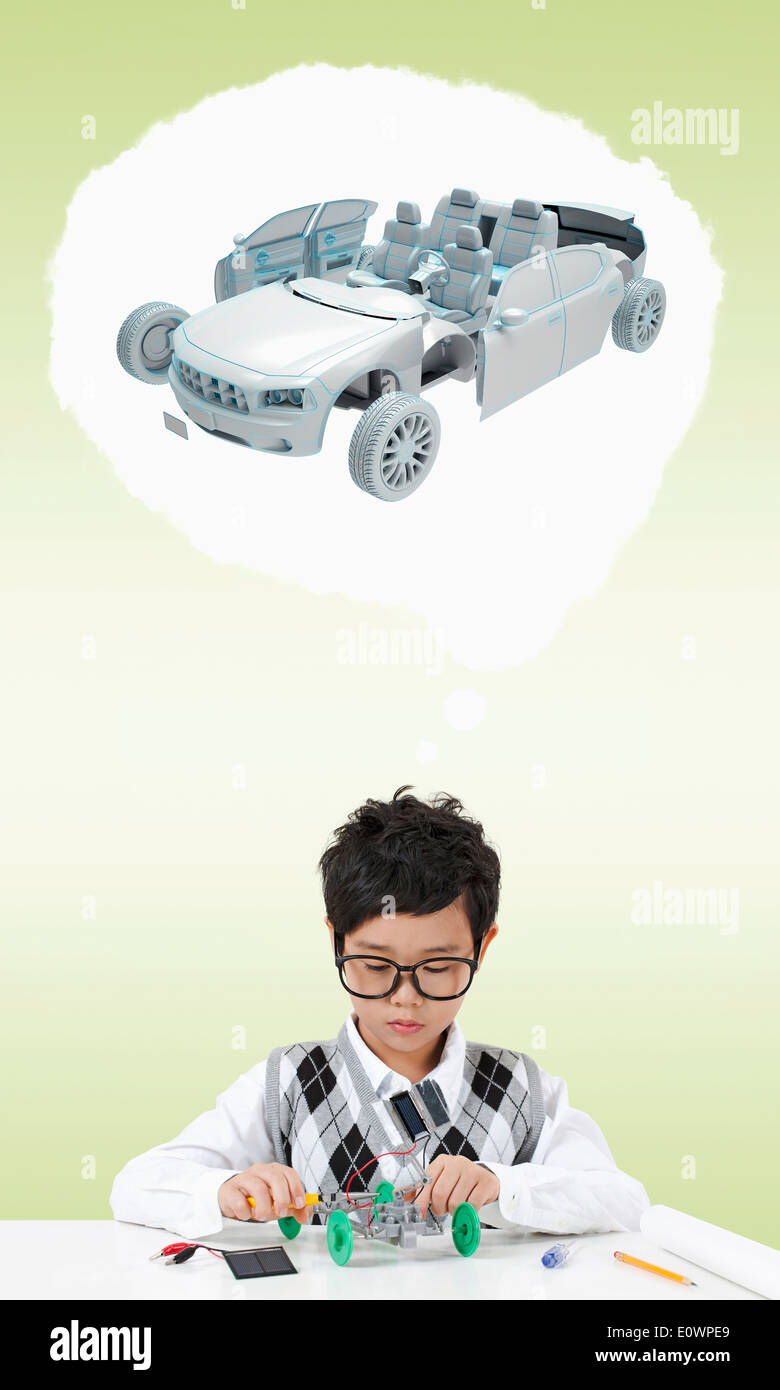 a boy dreaming of constructing a car Stock Photo - Alamy