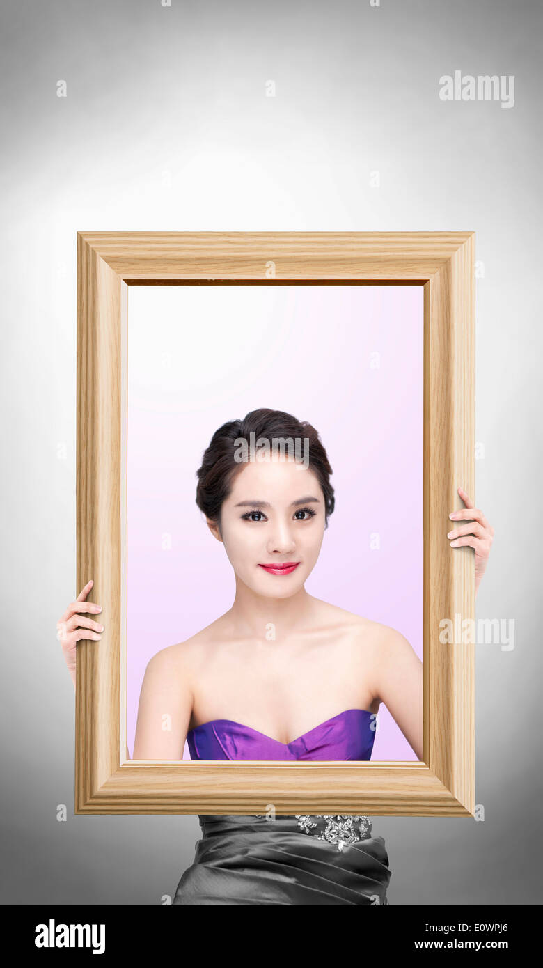 a woman in a frame Stock Photo - Alamy