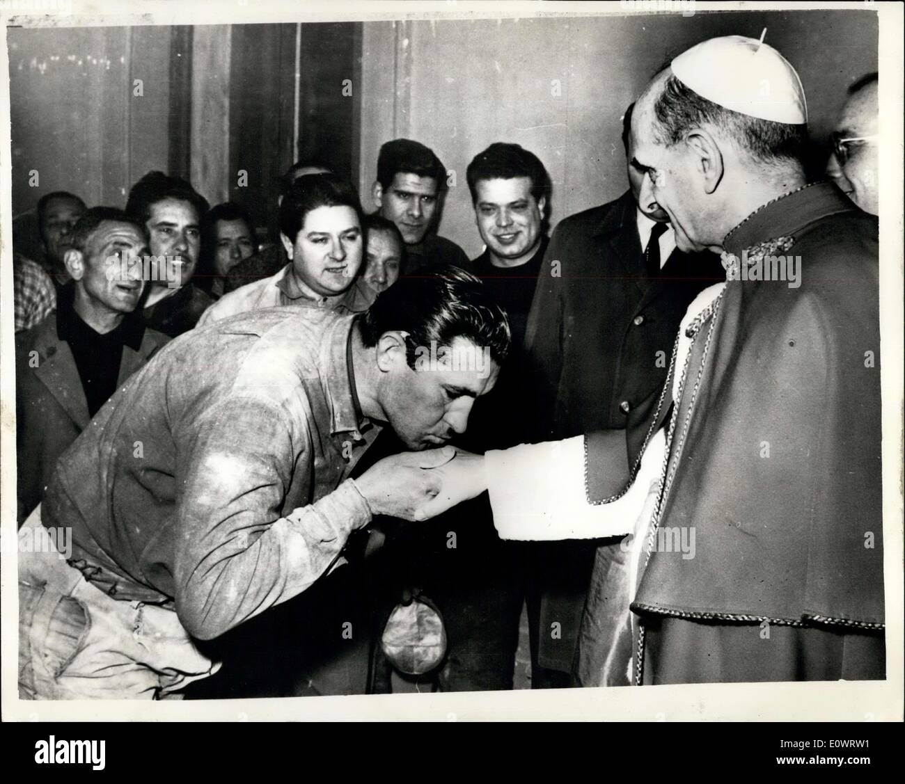 Feb. 08, 1964 - Workman kisses Pope's hand: Photo Shows A workman bends ...