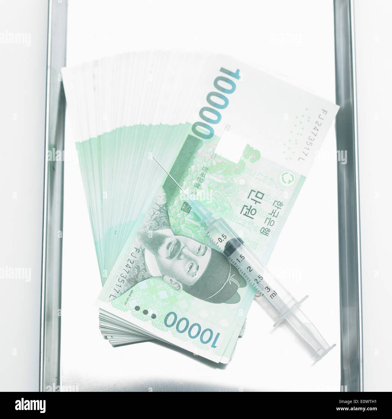 Money injection hi-res stock photography and images - Alamy