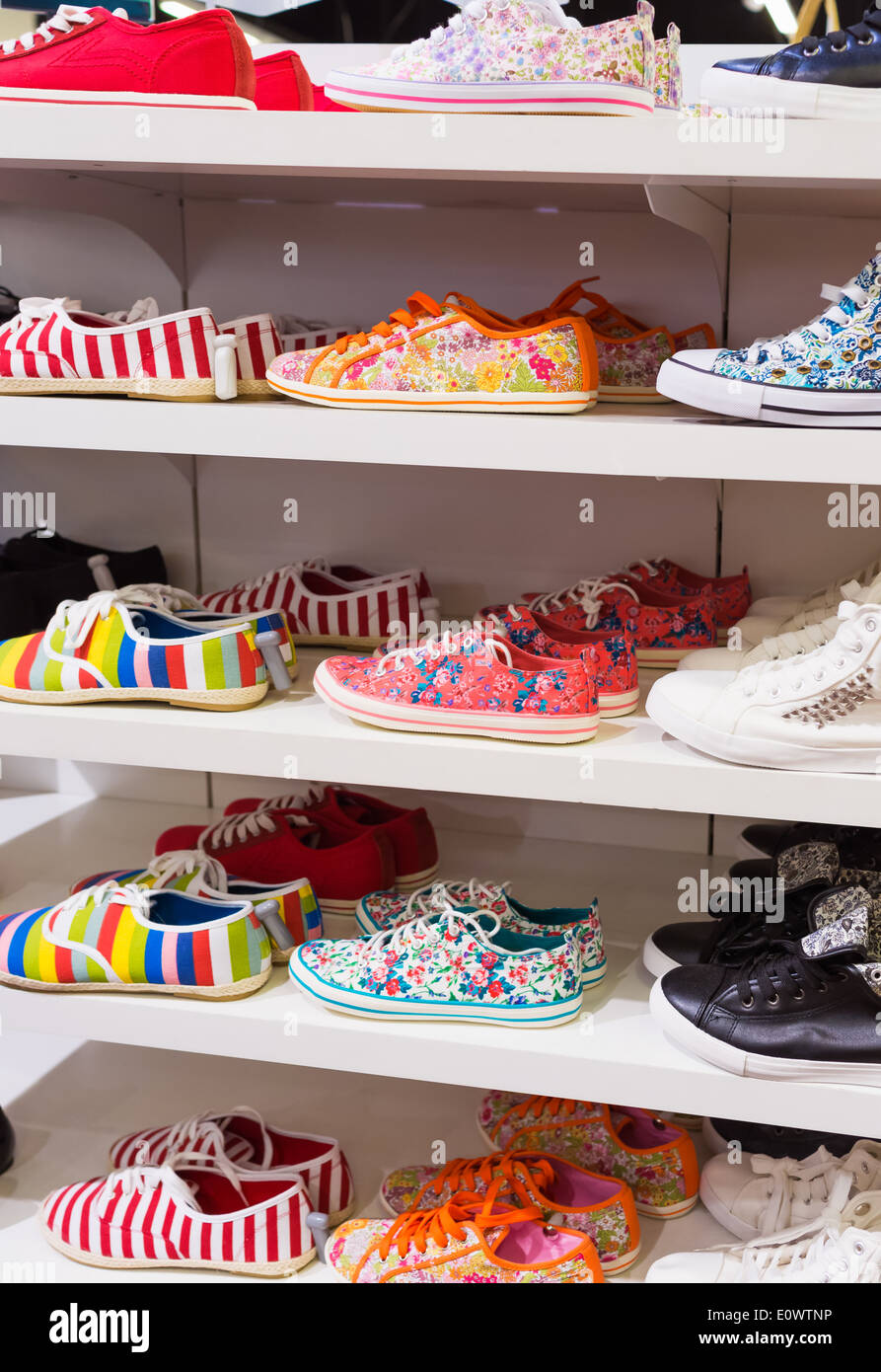 Background with shoes on shelves of shop Stock Photo - Alamy