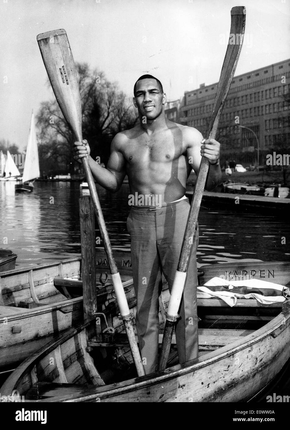 Boxer Kirk Barrow in a row boat Stock Photo - Alamy