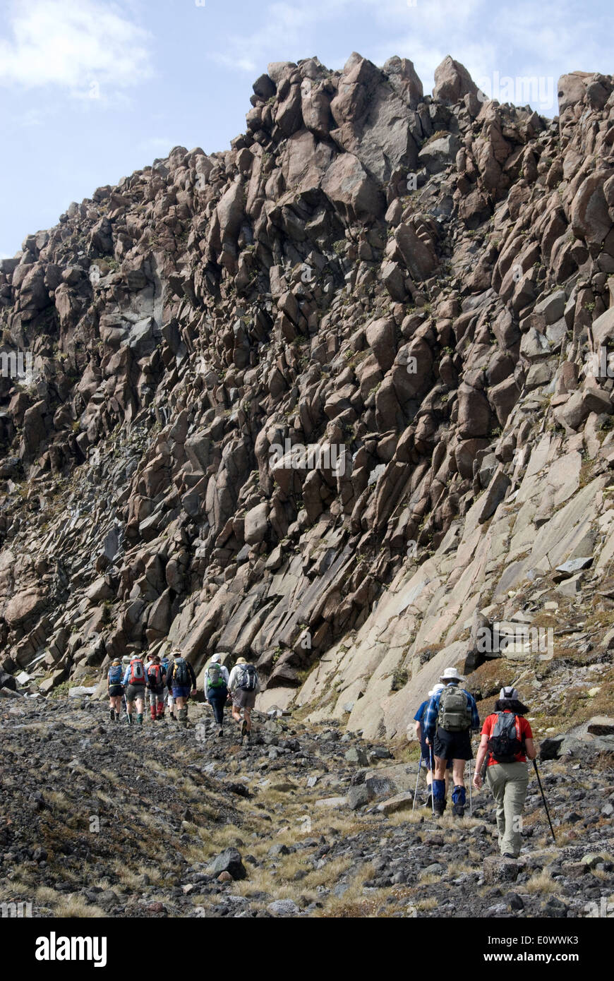 Hikers walking on lava flow, Mount Ngaruhoe, Tongariro National Park ...
