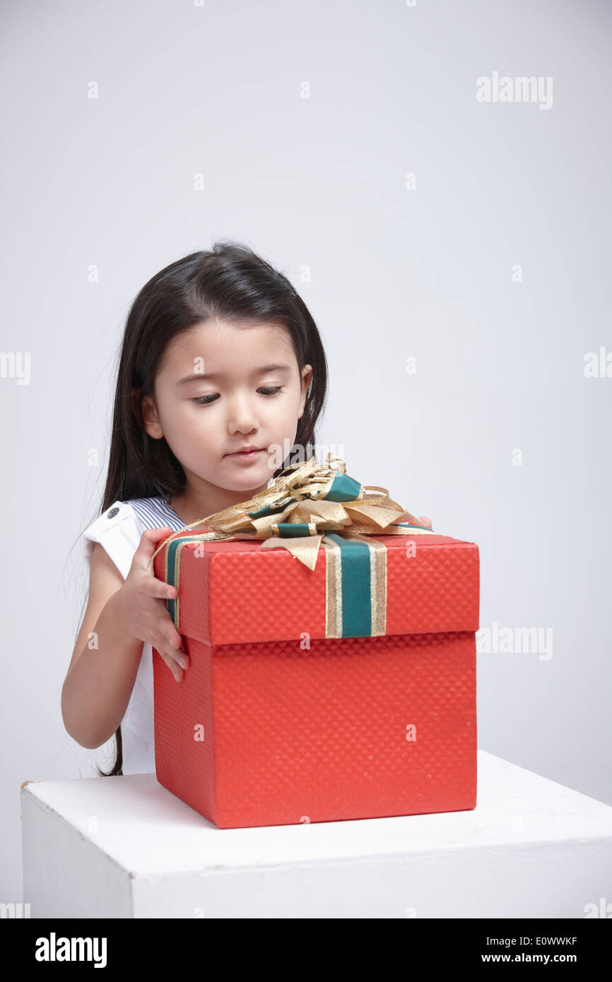 a girl opening a box Stock Photo - Alamy