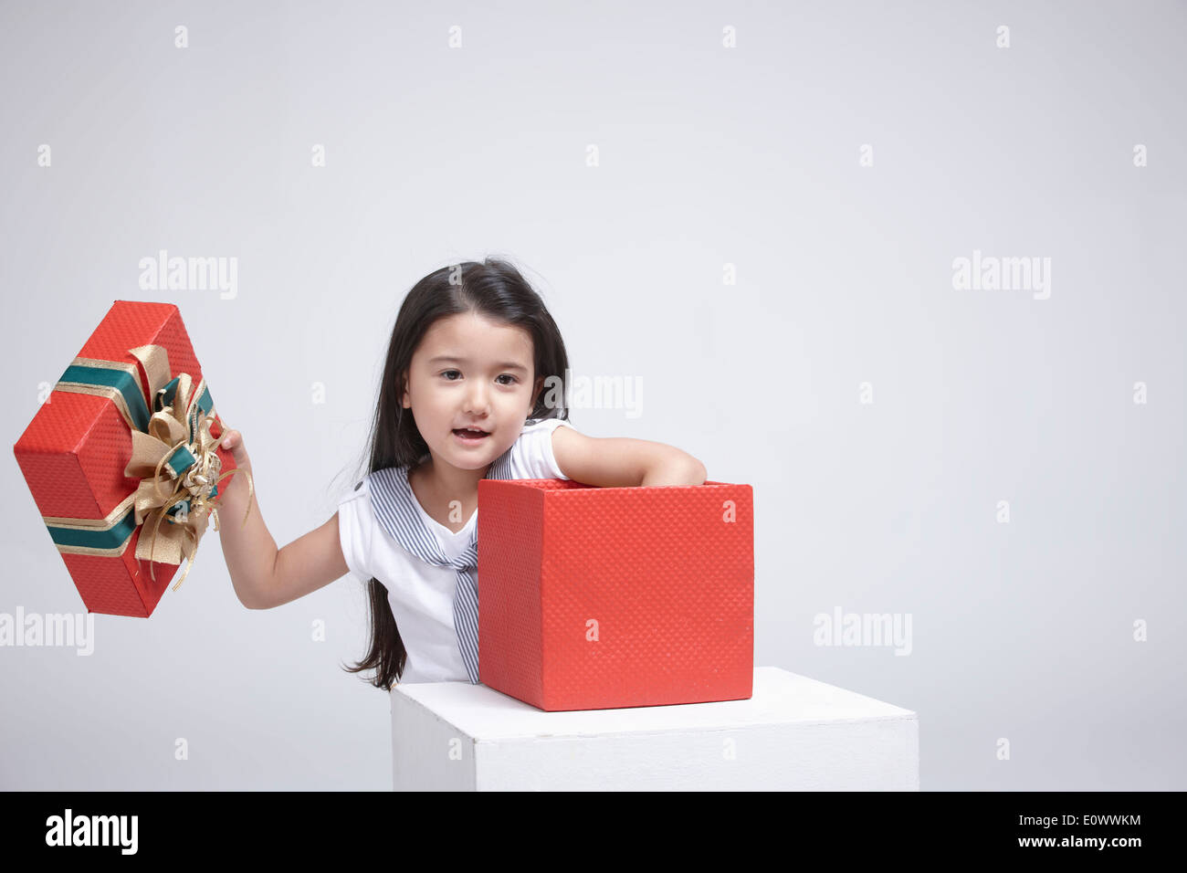 a girl opening a box Stock Photo - Alamy