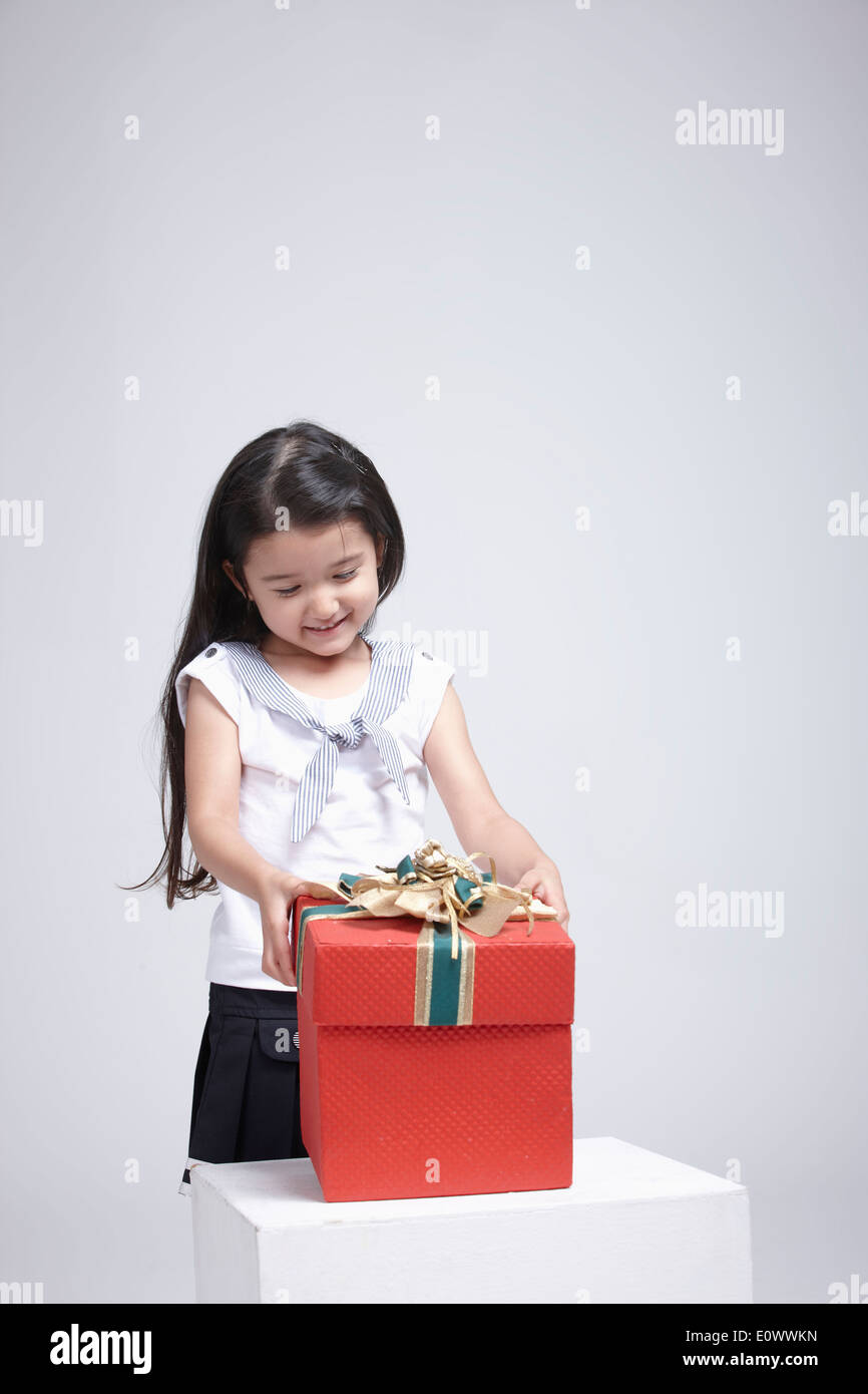 a girl opening a box Stock Photo - Alamy