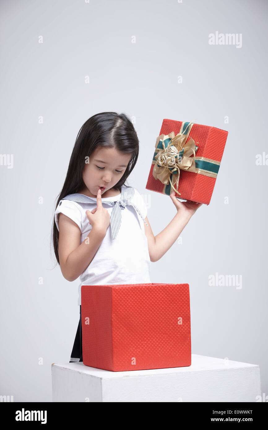 a girl opening a box Stock Photo - Alamy