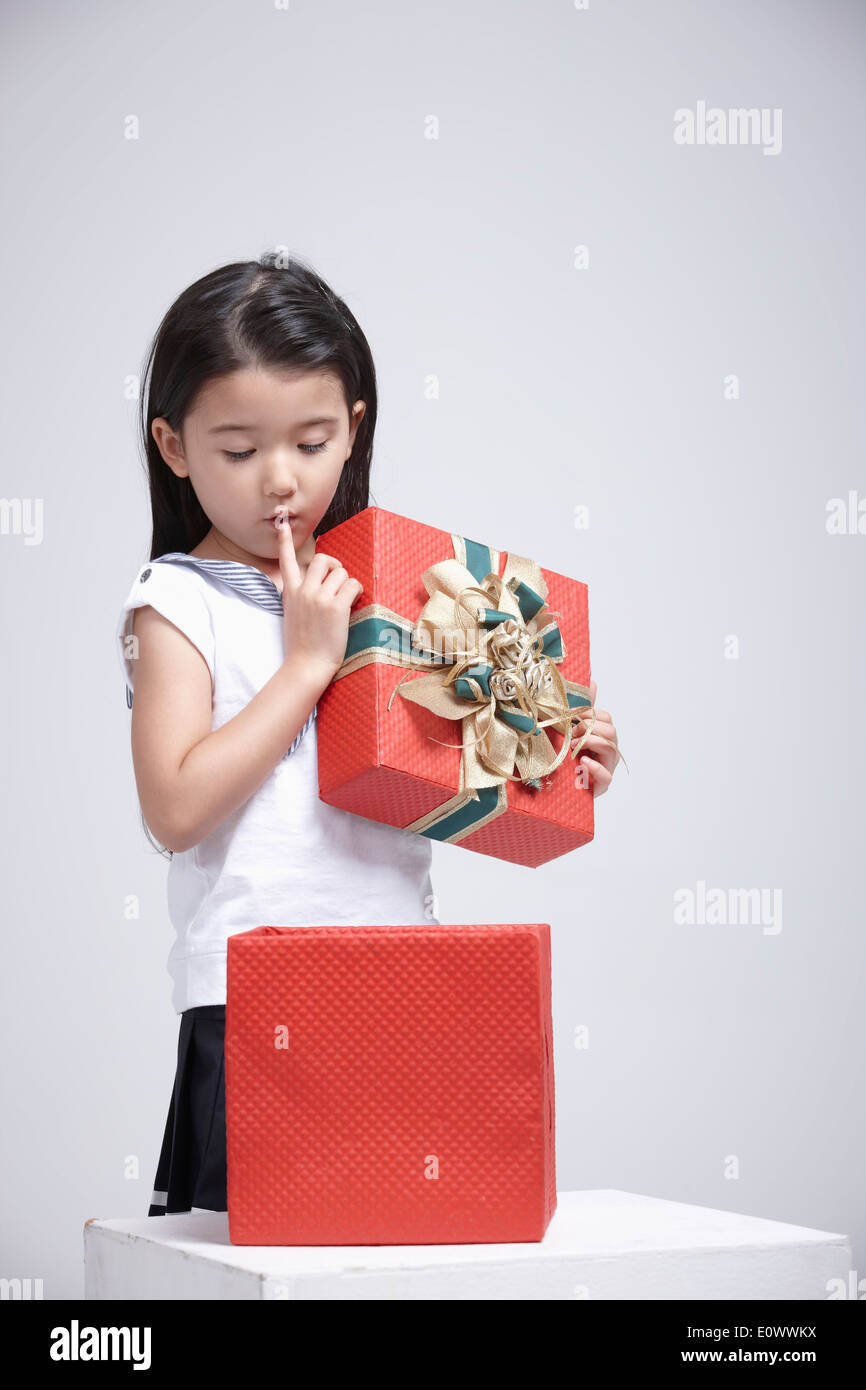 a girl opening a box Stock Photo - Alamy