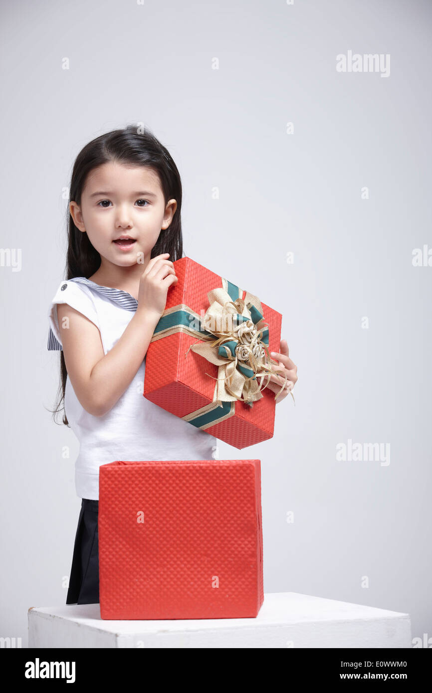 a girl opening a box Stock Photo - Alamy