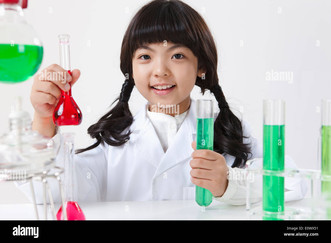 a girl doing chemistry Stock Photo - Alamy