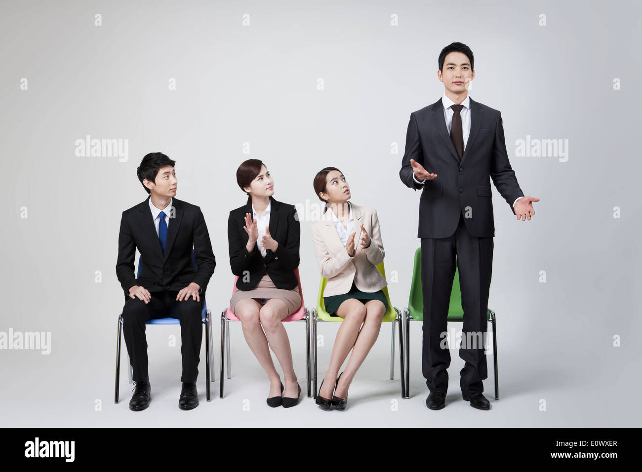 business people sitting in a row Stock Photo - Alamy