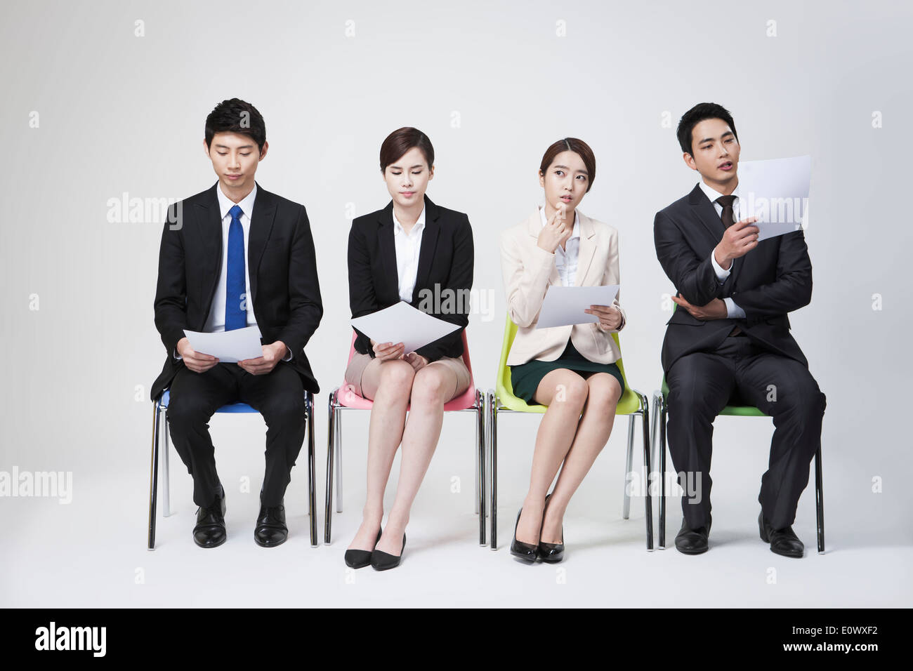 business people sitting in a row Stock Photo - Alamy