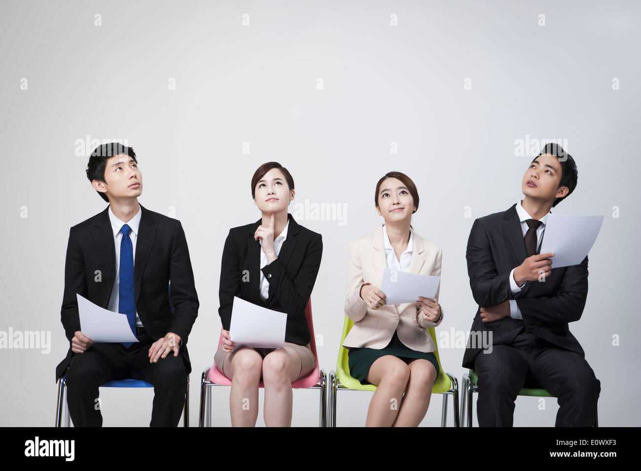 business people sitting in a row Stock Photo - Alamy